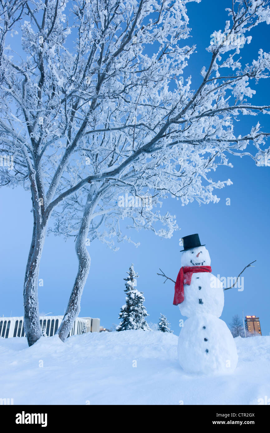 Snowman standing in Delaney Parkstrip downtown Anchorage in background ...