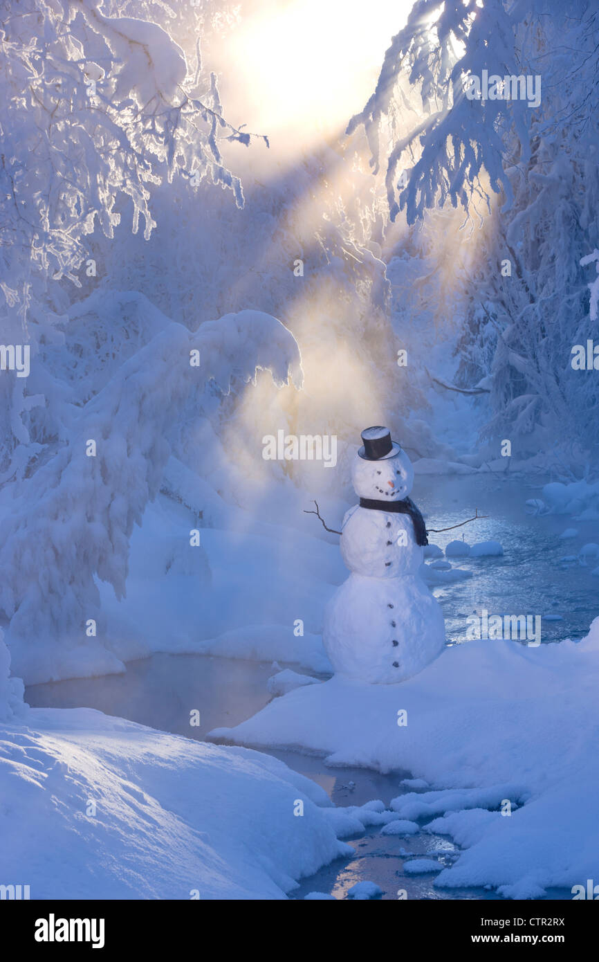 Snowman standing next stream sunrays shining through fog hoar frosted ...