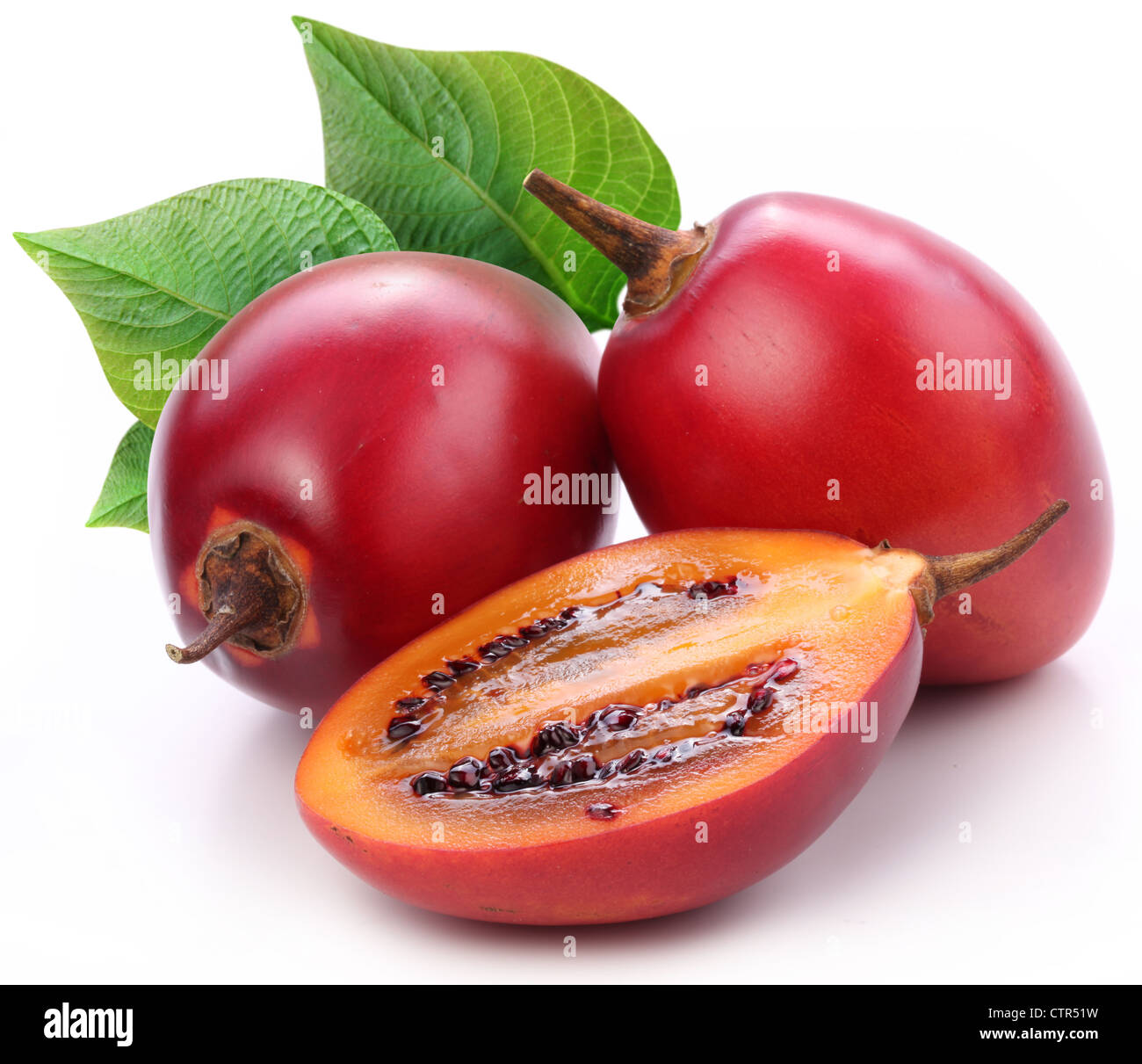 Tamarillo fruits with leaves on white background Stock Photo - Alamy