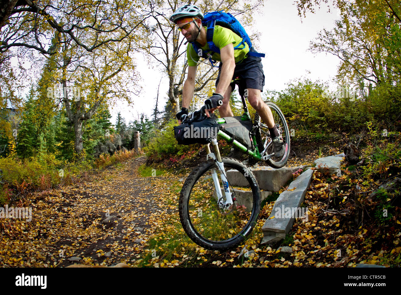 Man mountain biking over rocks, Anchorage hillside trails, Southcentral ...
