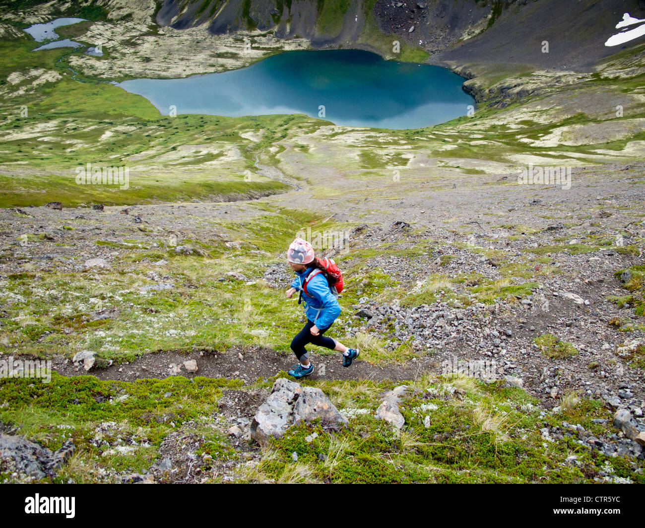 Female runner on mountain trail hi-res stock photography and images - Alamy