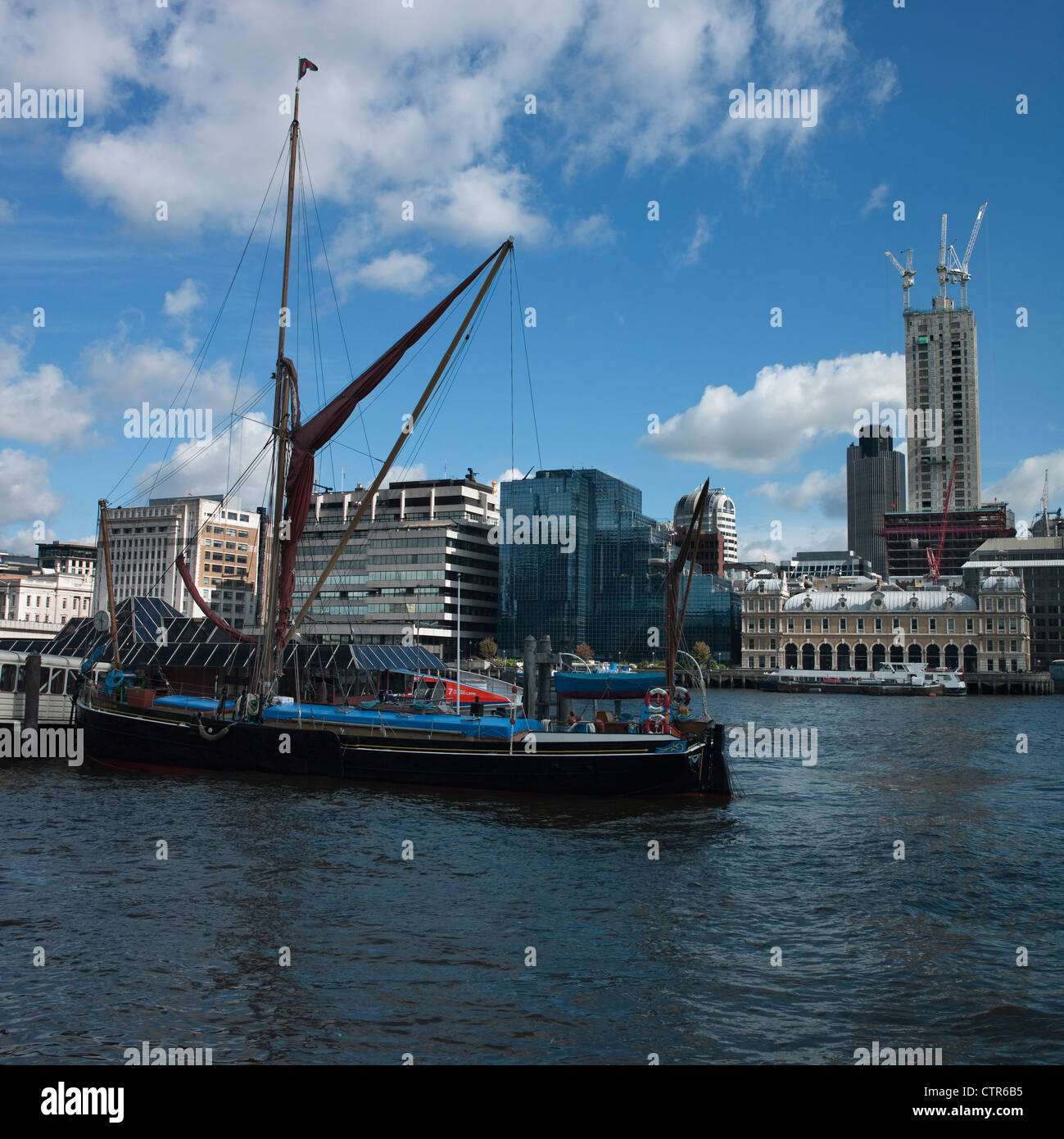 Traditional Thames Barge moored on the river Thames opposite ...