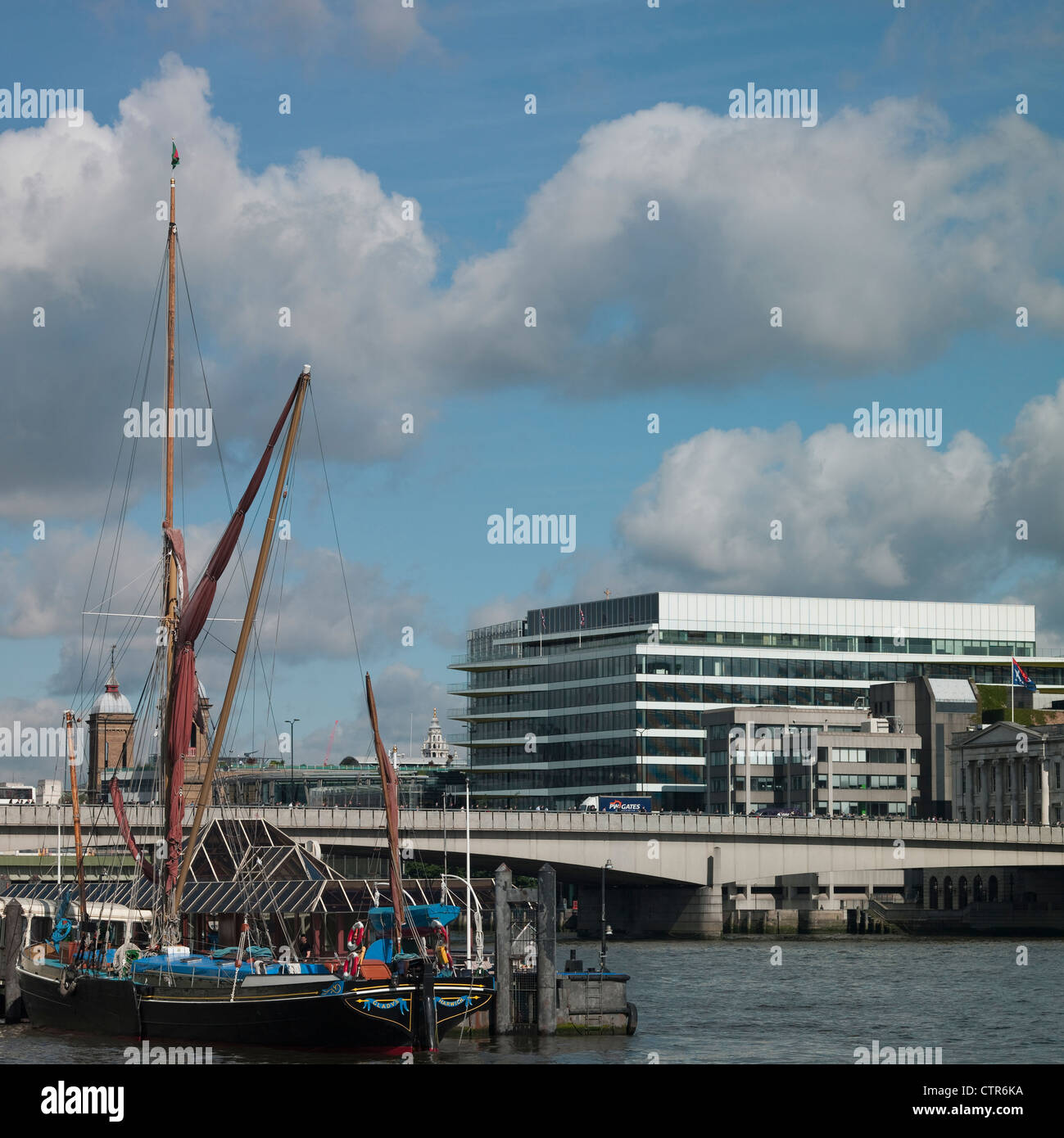 River thames with barge and city of london offices hi-res stock ...