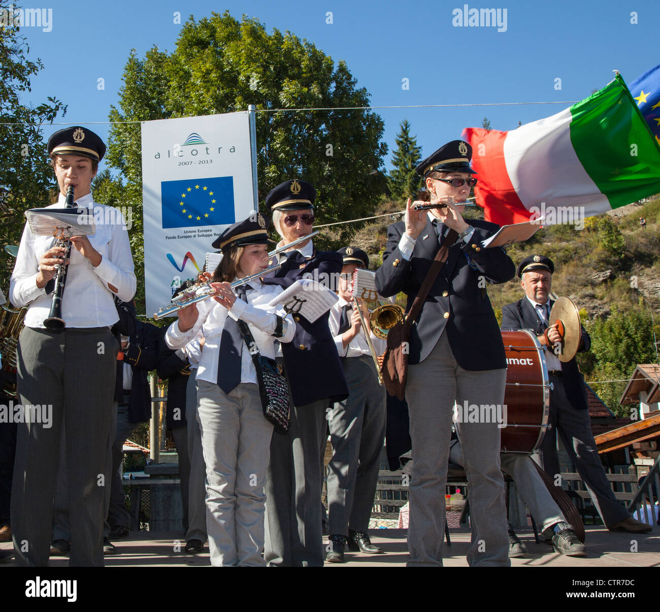Italian town band playing music instruments at a festival in Oulx ...