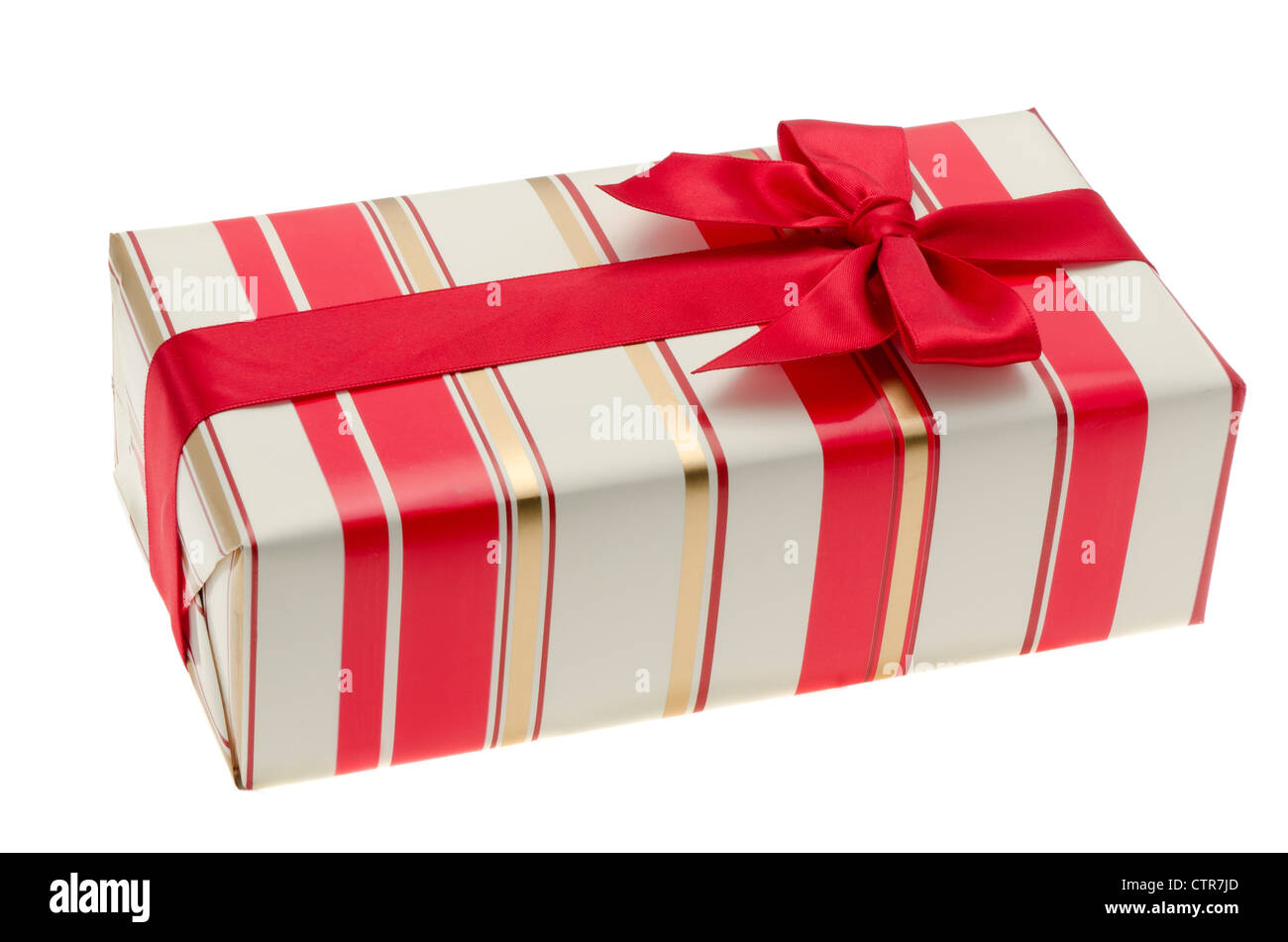 Bright red gift wrapped box with ribbon and bow - studio shot with a ...