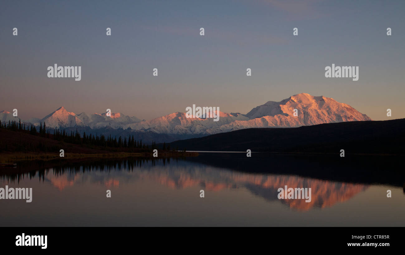 Sunset view of Mt. McKinley and Mt. Deception reflecting in Wonder Lake ...
