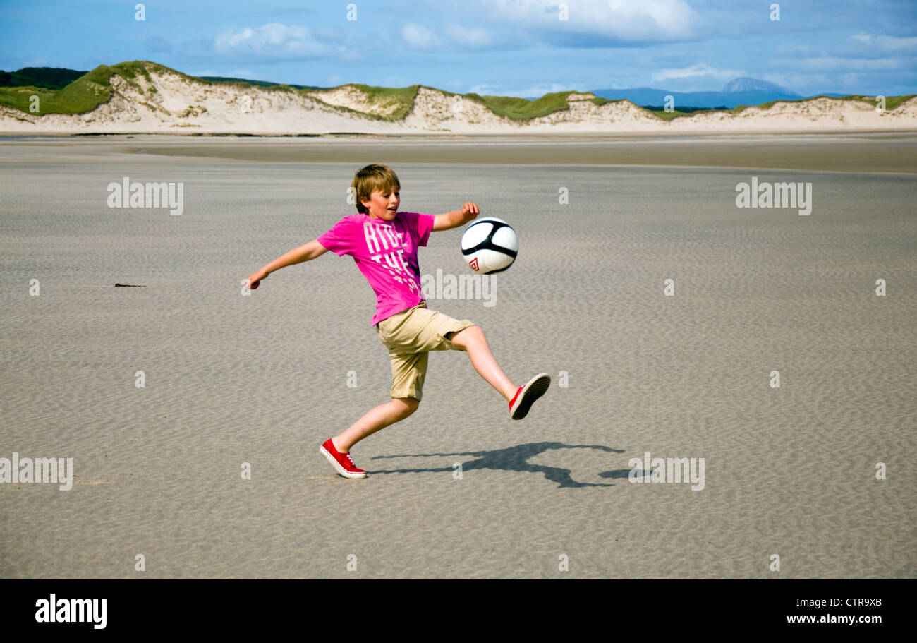 Football on beach hi-res stock photography and images - Alamy