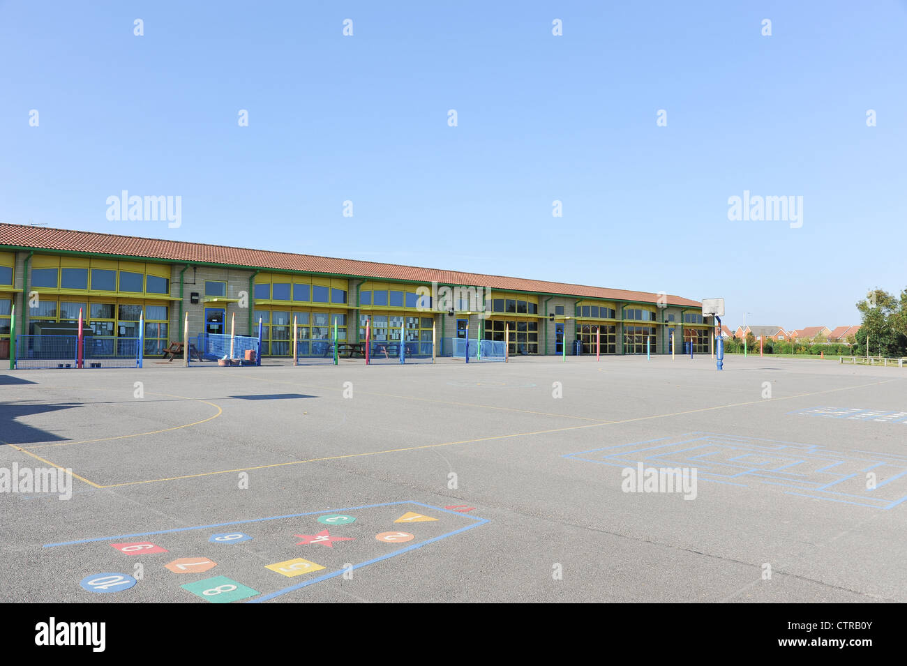 Modern school building and playground - UK infant/junior school pupils ...