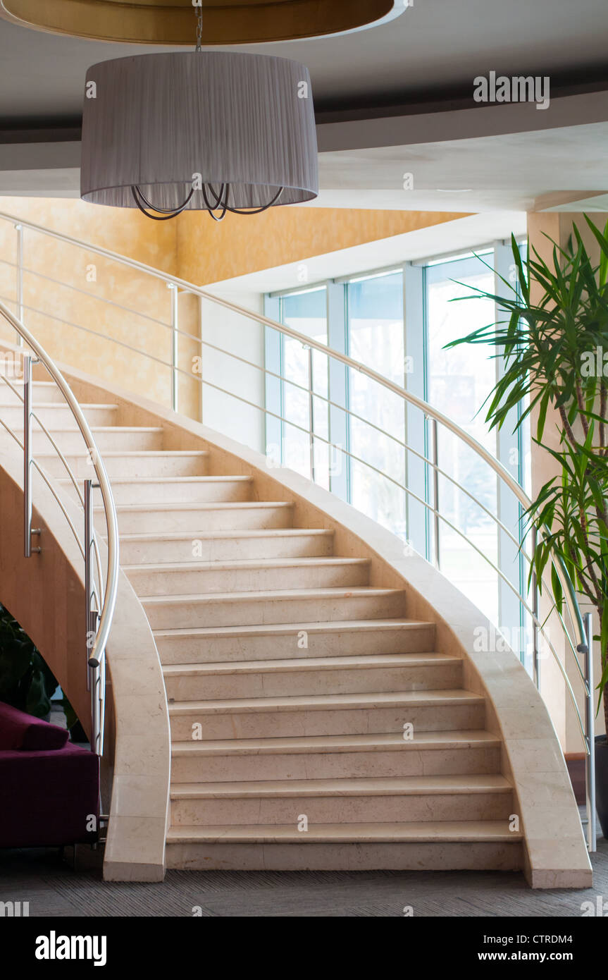 Modern staircase in hotel foyer with daylight from window Stock Photo ...