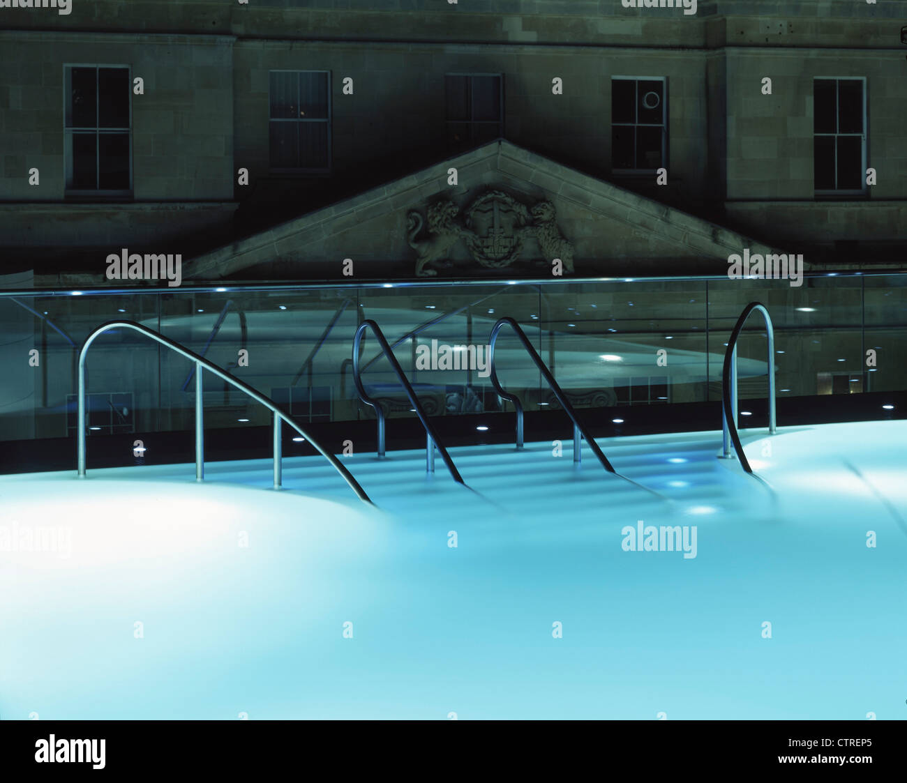 thema bath spa night shot of roof top pool Stock Photo - Alamy