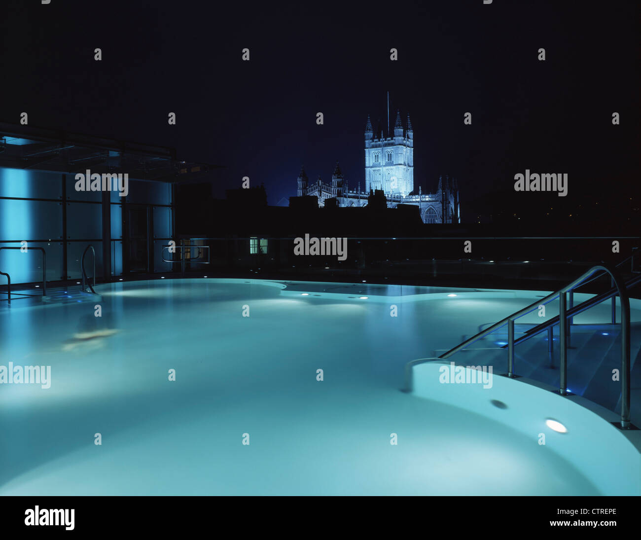 thema bath spa night shot of roof top pool Stock Photo - Alamy
