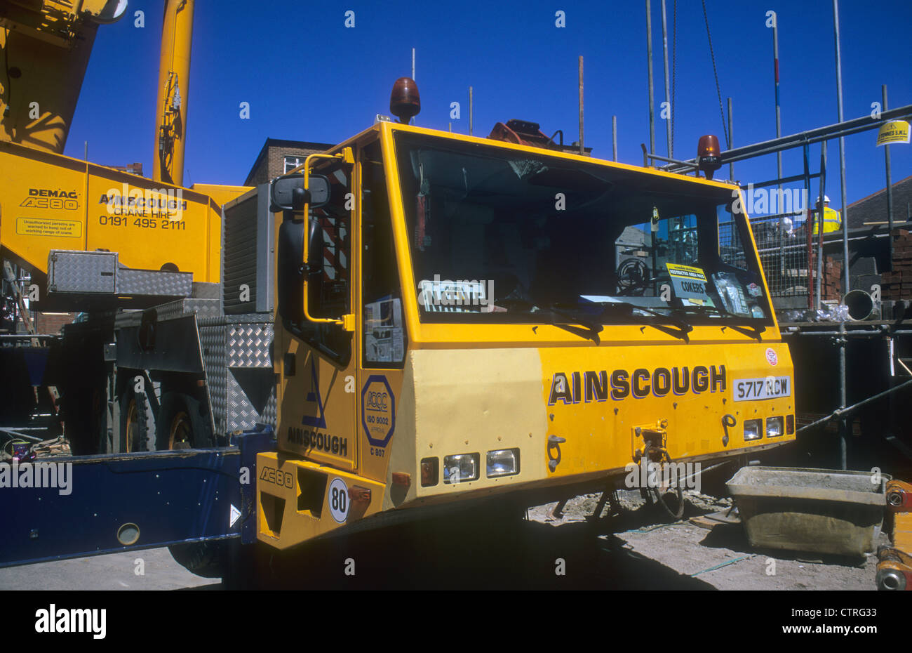 Demag-AC80 mobile crane with a 80 ton lift capacity operating in a ...