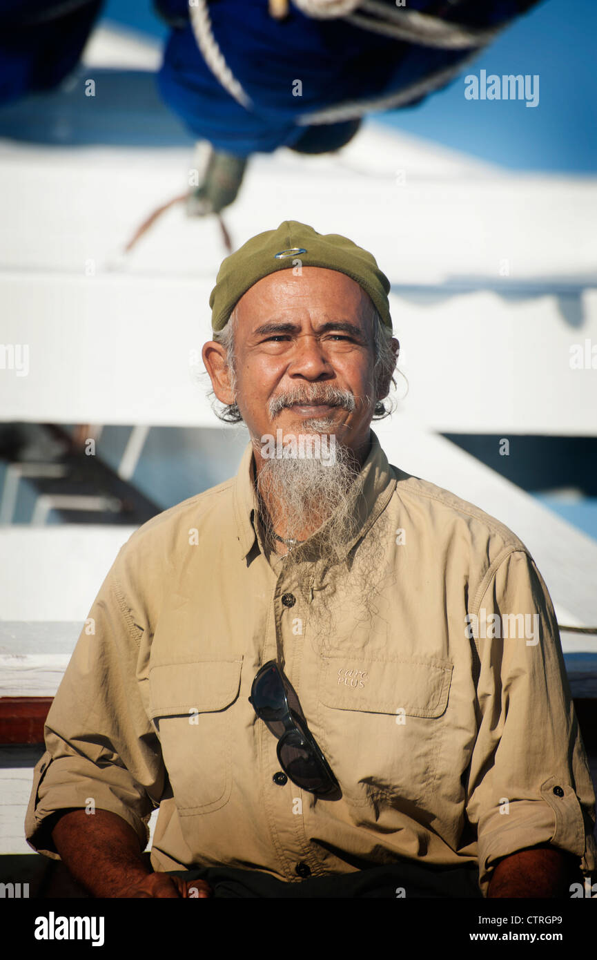 A crewman aboard the "Ombak Putih", a traditional Pinisi schooner ...