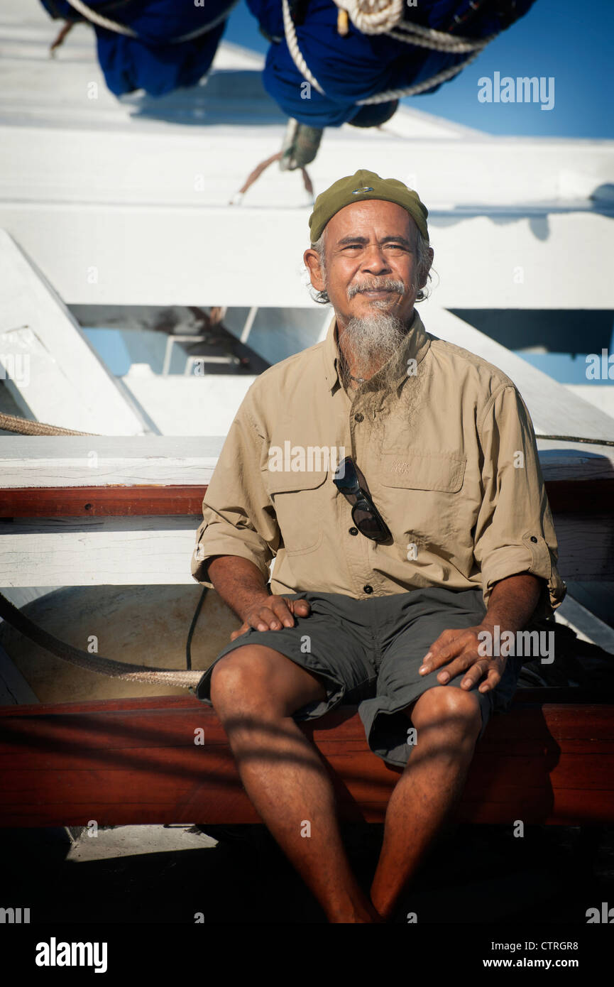A crewman aboard the "Ombak Putih", a traditional Pinisi schooner ...