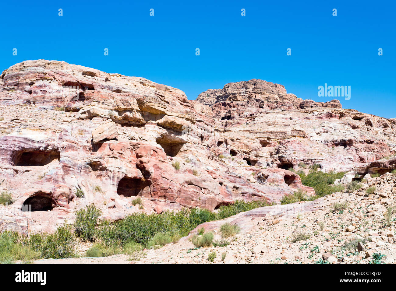 Old caverns in ancient stone city Petra, Jordan Stock Photo - Alamy