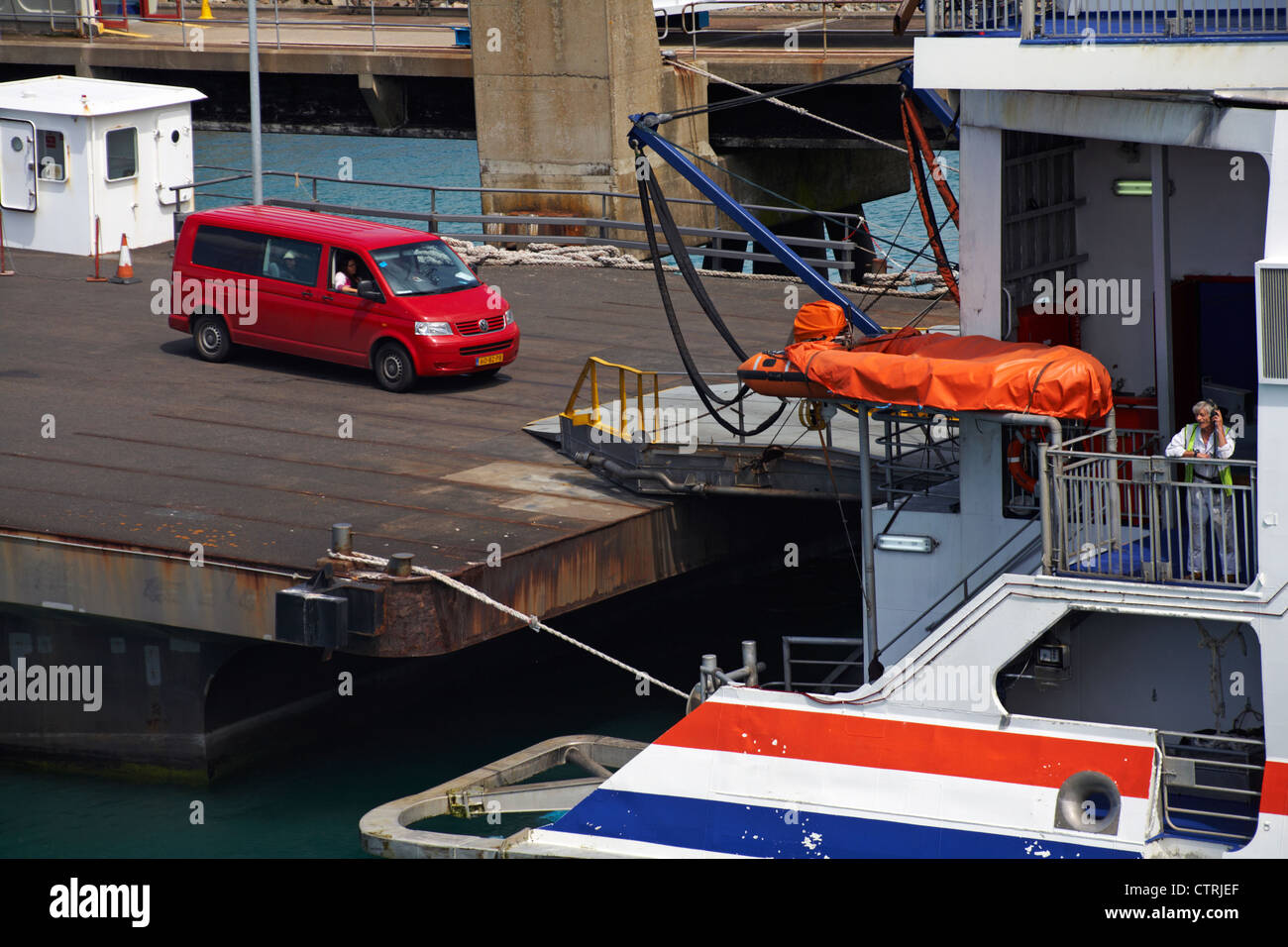Red Volkswagen van about to board Condor ferry at St Helier, Jersey in ...