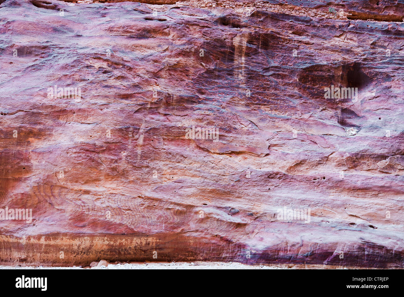 multicolored sandstone wall of gorge Siq in Petra, Jordan Stock Photo ...