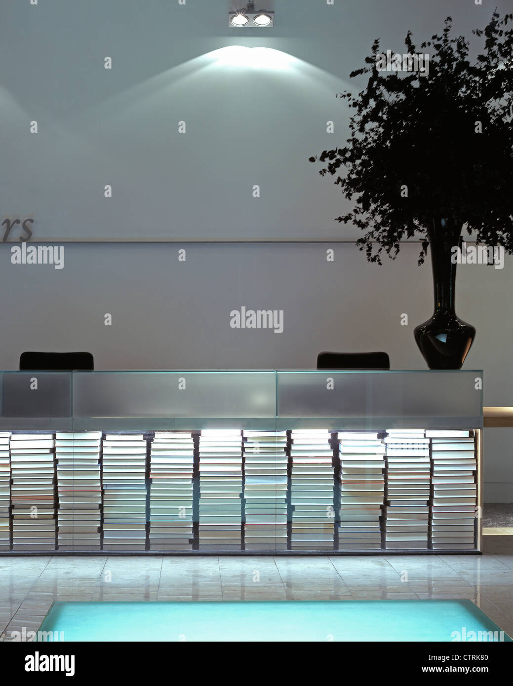 harper collins office reception desk with books Stock Photo - Alamy