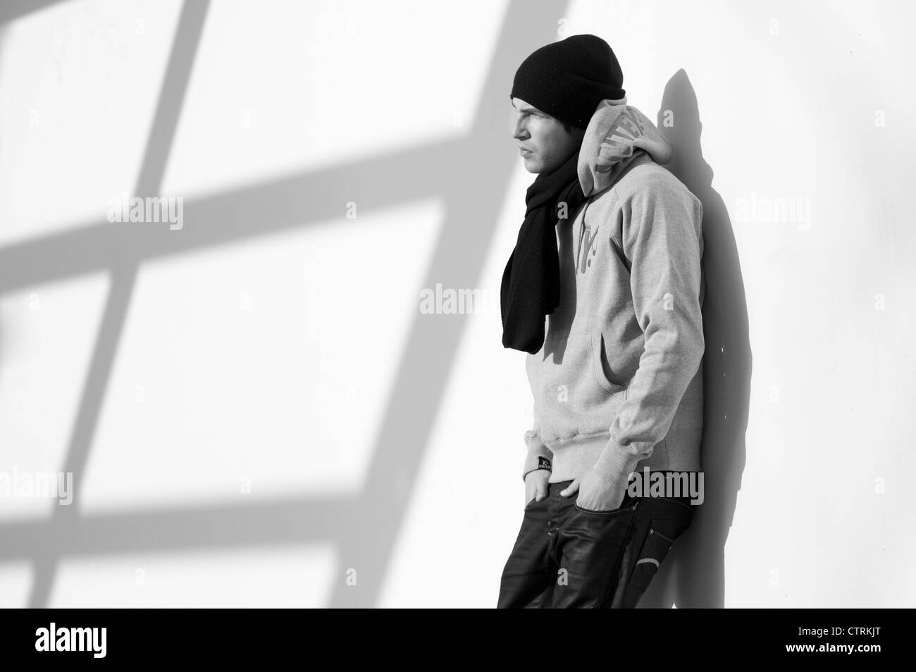 Younger man standing Black and White Stock Photos & Images - Alamy