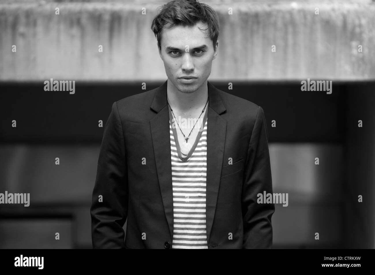 Young man short hair standing Black and White Stock Photos & Images - Alamy