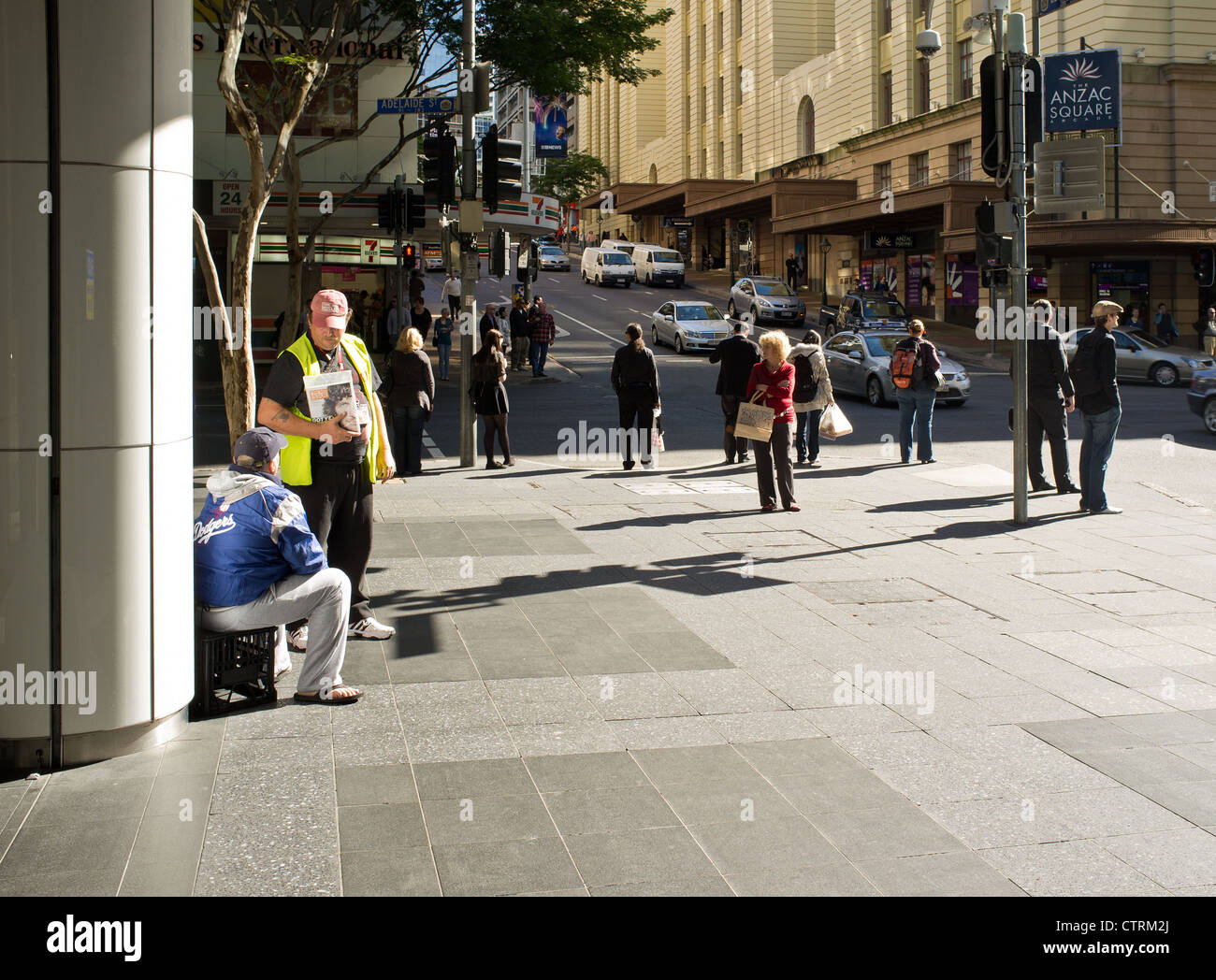 People on a street corner in Brisbane Stock Photo - Alamy