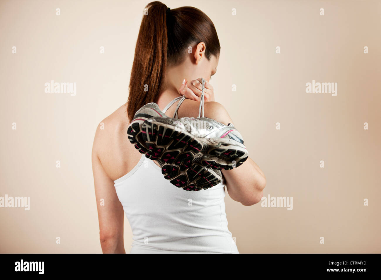 Beautiful young woman carrying shoes hi-res stock photography and ...