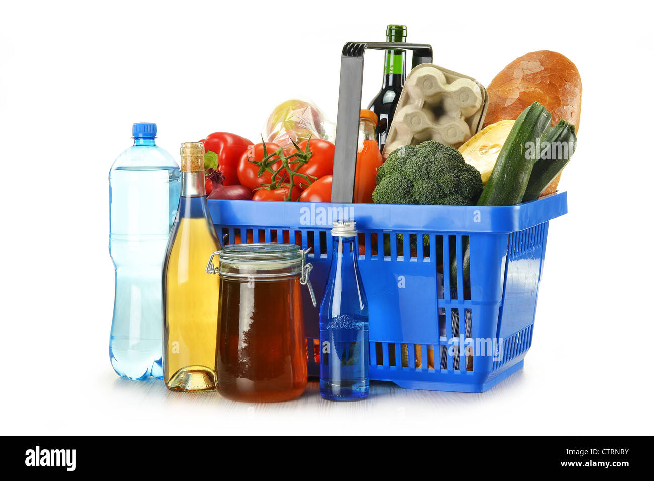 Grocery in shopping basket isolated on white Stock Photo - Alamy
