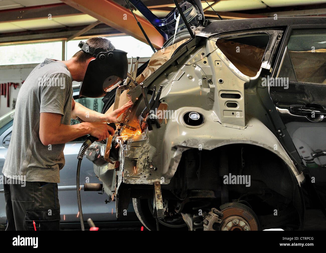 Car body worker Stock Photo - Alamy