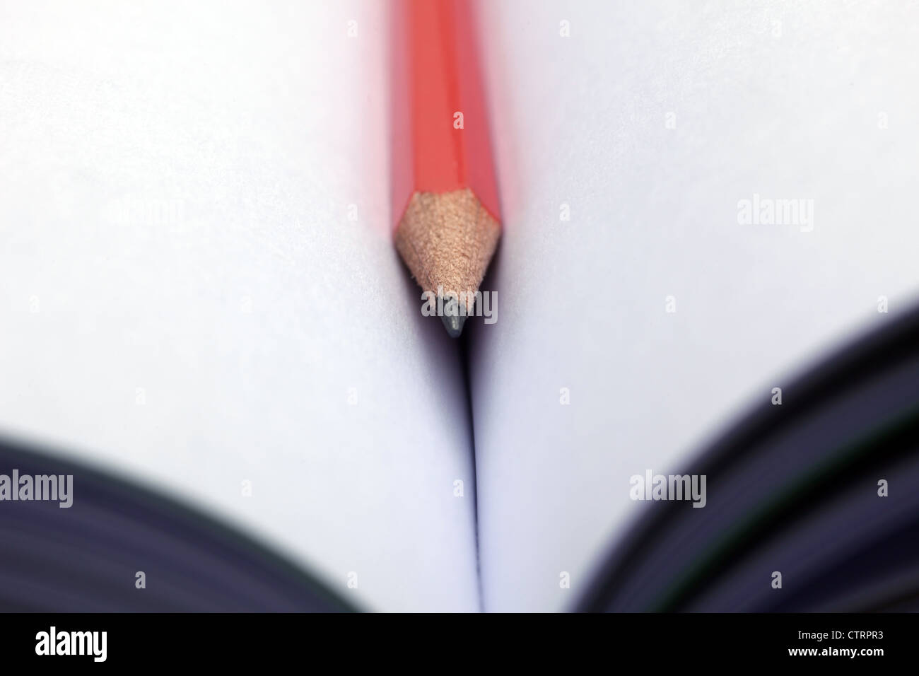 Open book with pencil Stock Photo - Alamy