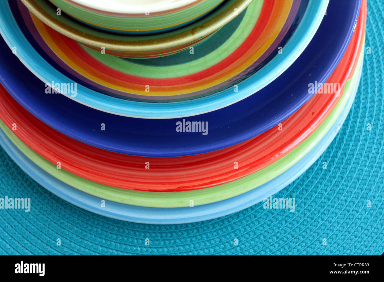 A stack of colourful plates and bowls Stock Photo - Alamy