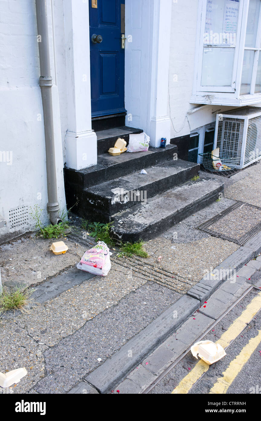 Discarded takeaway food boxes and packaging littering the street and ...