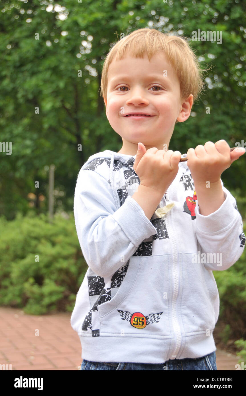 Portrait of a toddler boy smiling outdoor Stock Photo - Alamy