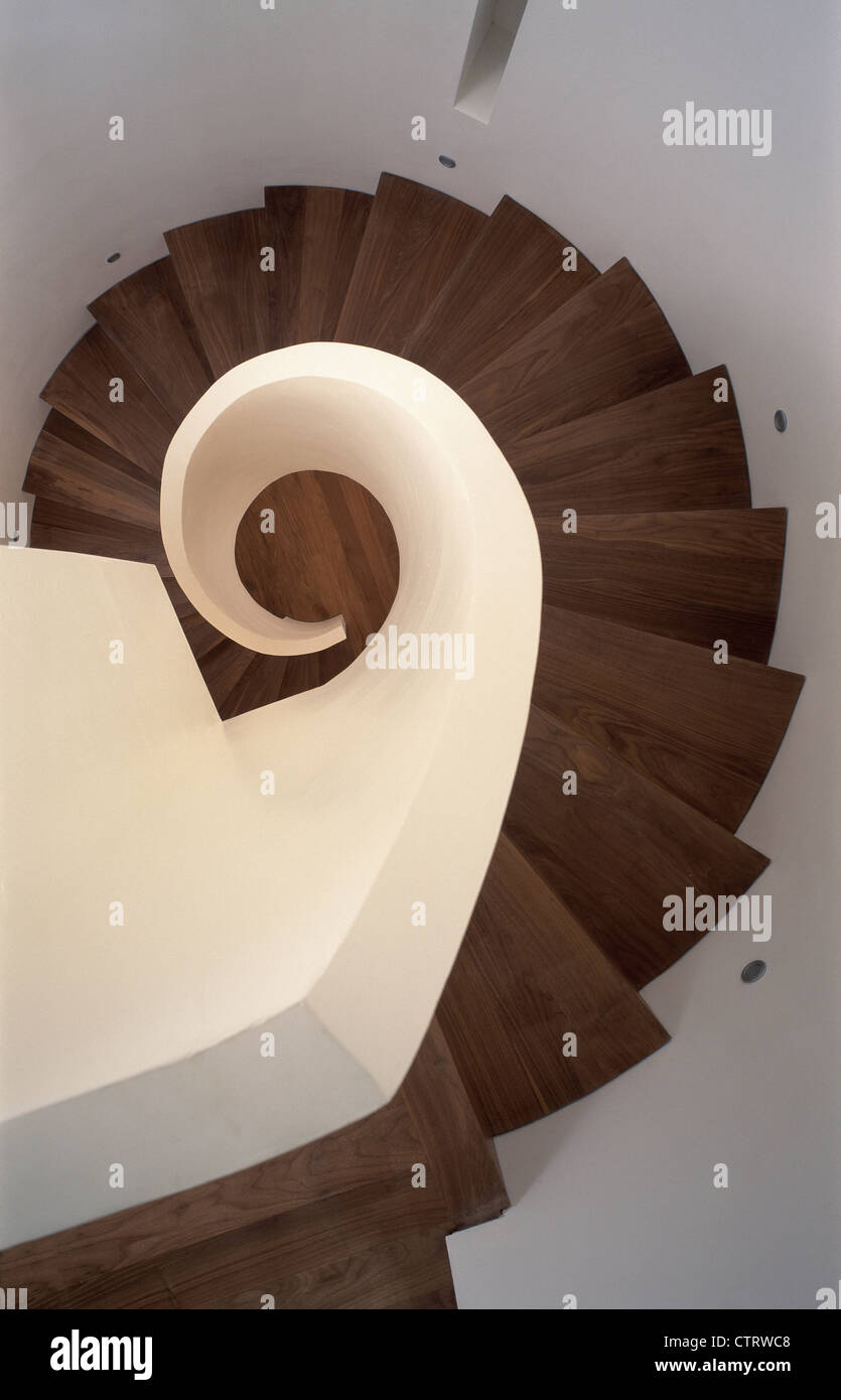 private house view down spiral staircase Stock Photo - Alamy