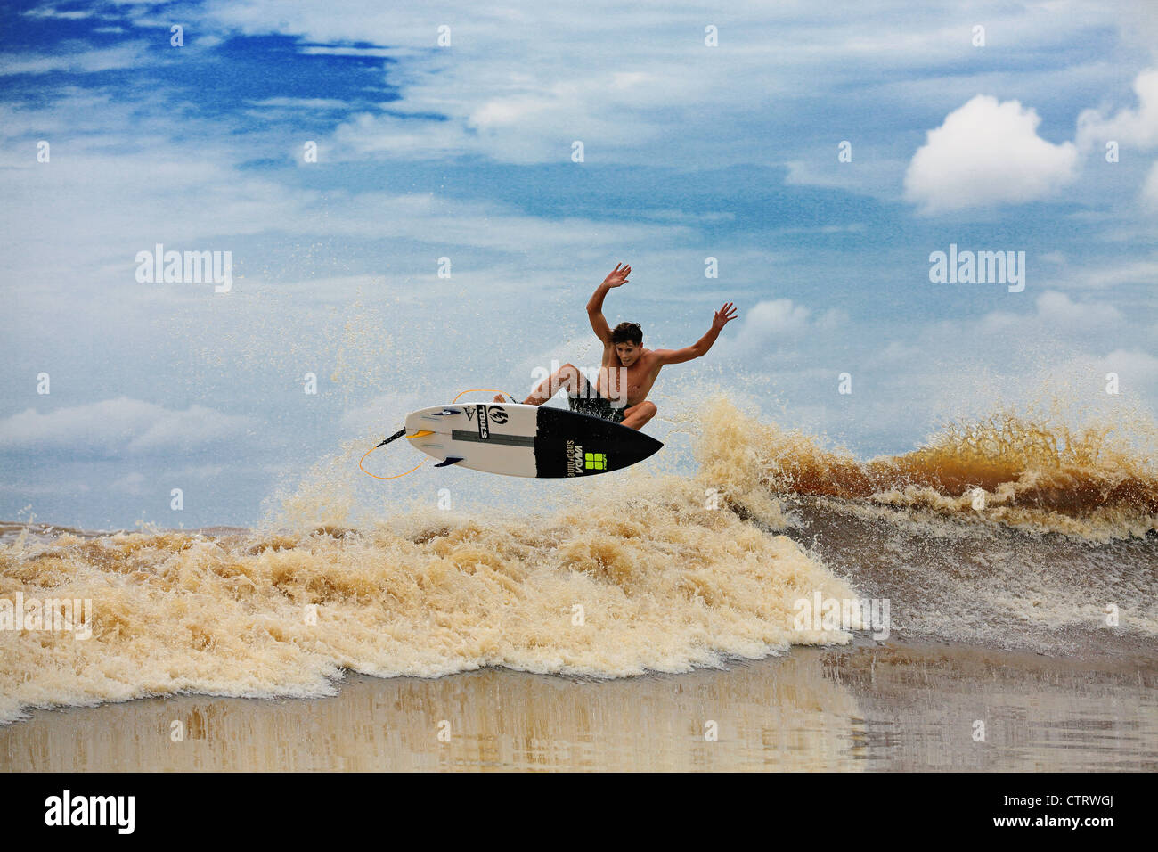Australian surfer Mikey Barber surfing a river tidal wave bore known ...