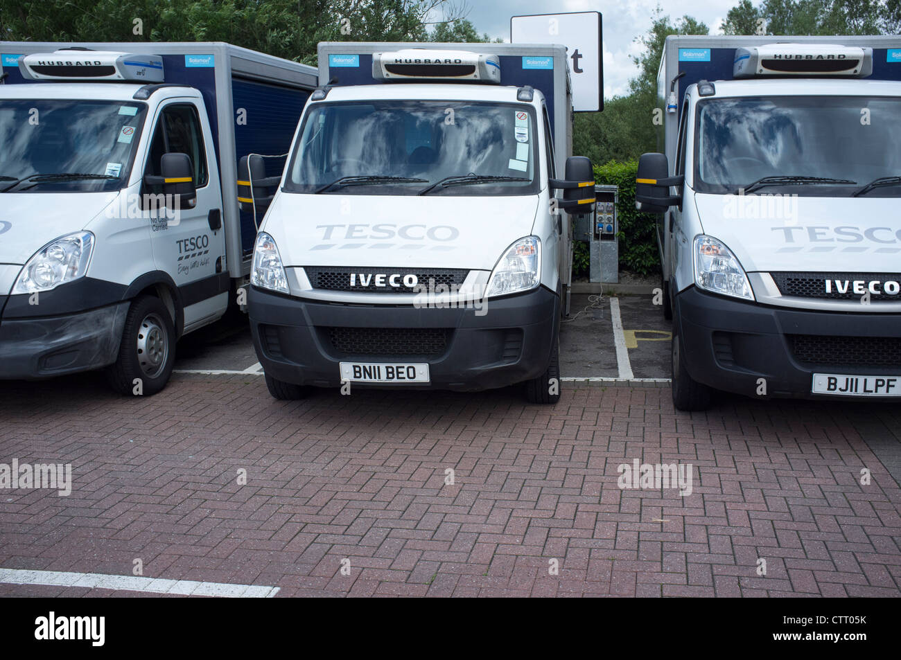 Electric Delivery Vehicles charging at Tescos Stock Photo - Alamy