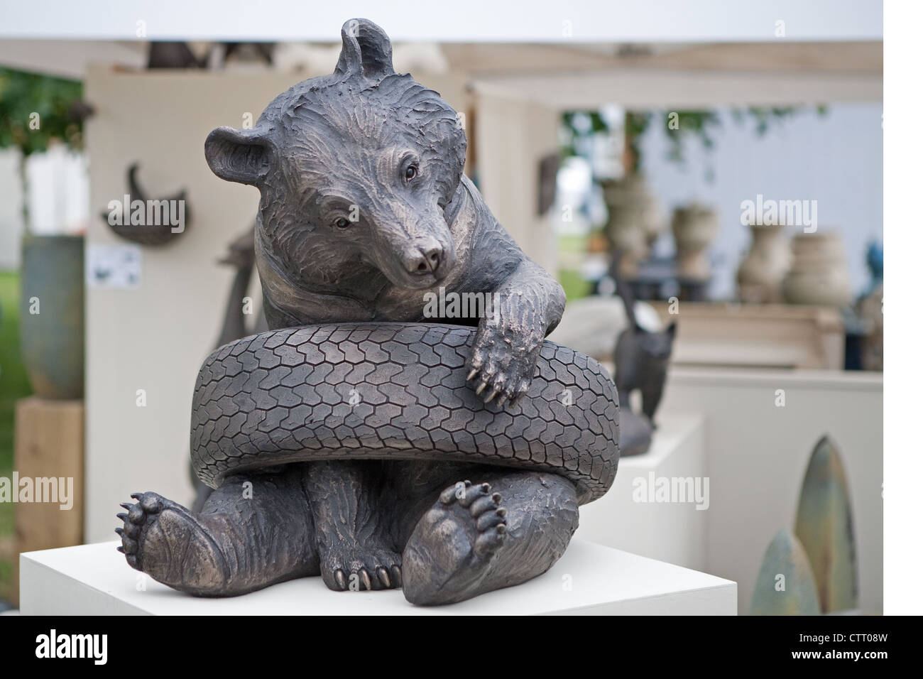 A Bear in a tyre statue at RHS Hampton court Palace flower show 2012 ...