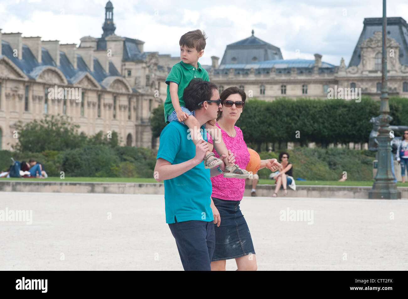 Paris, France - Family tourists on vacation around the Louvre Museum ...