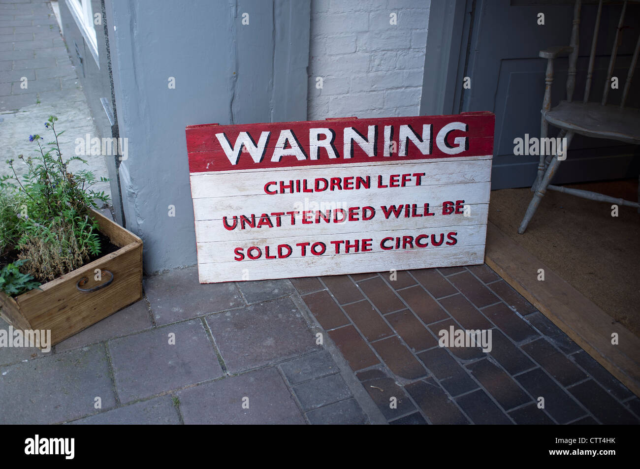 Joke Warning Sign outside Vintage Shop Stock Photo - Alamy