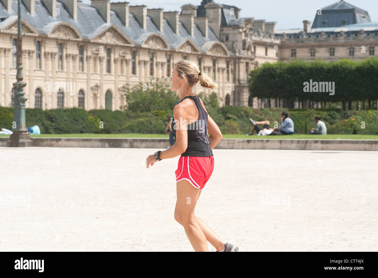 Paris, France - Young woman doing jogging Stock Photo - Alamy