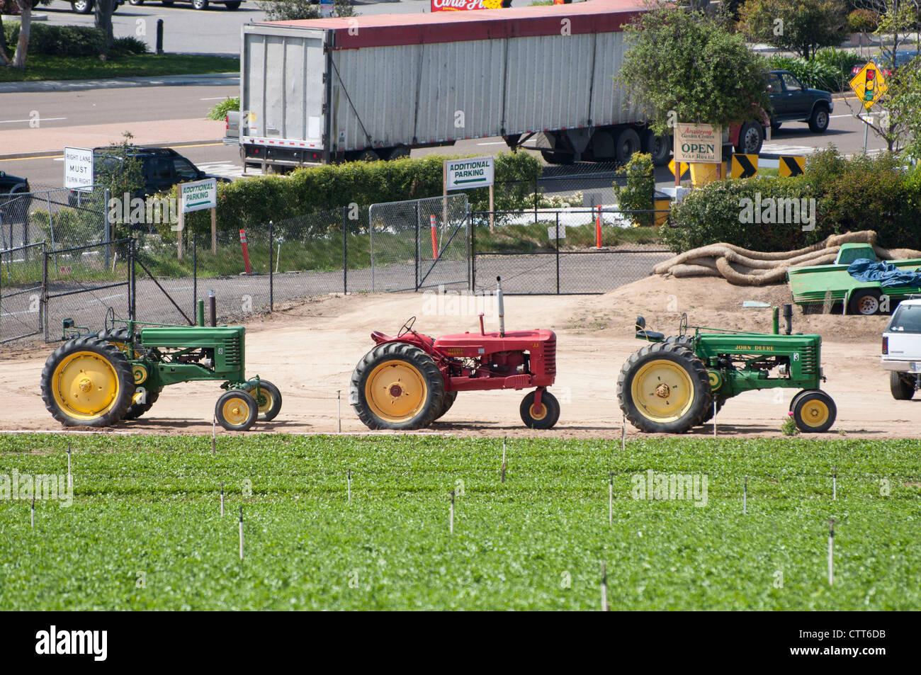 Cute Farm Tractor following each other Stock Photo - Alamy