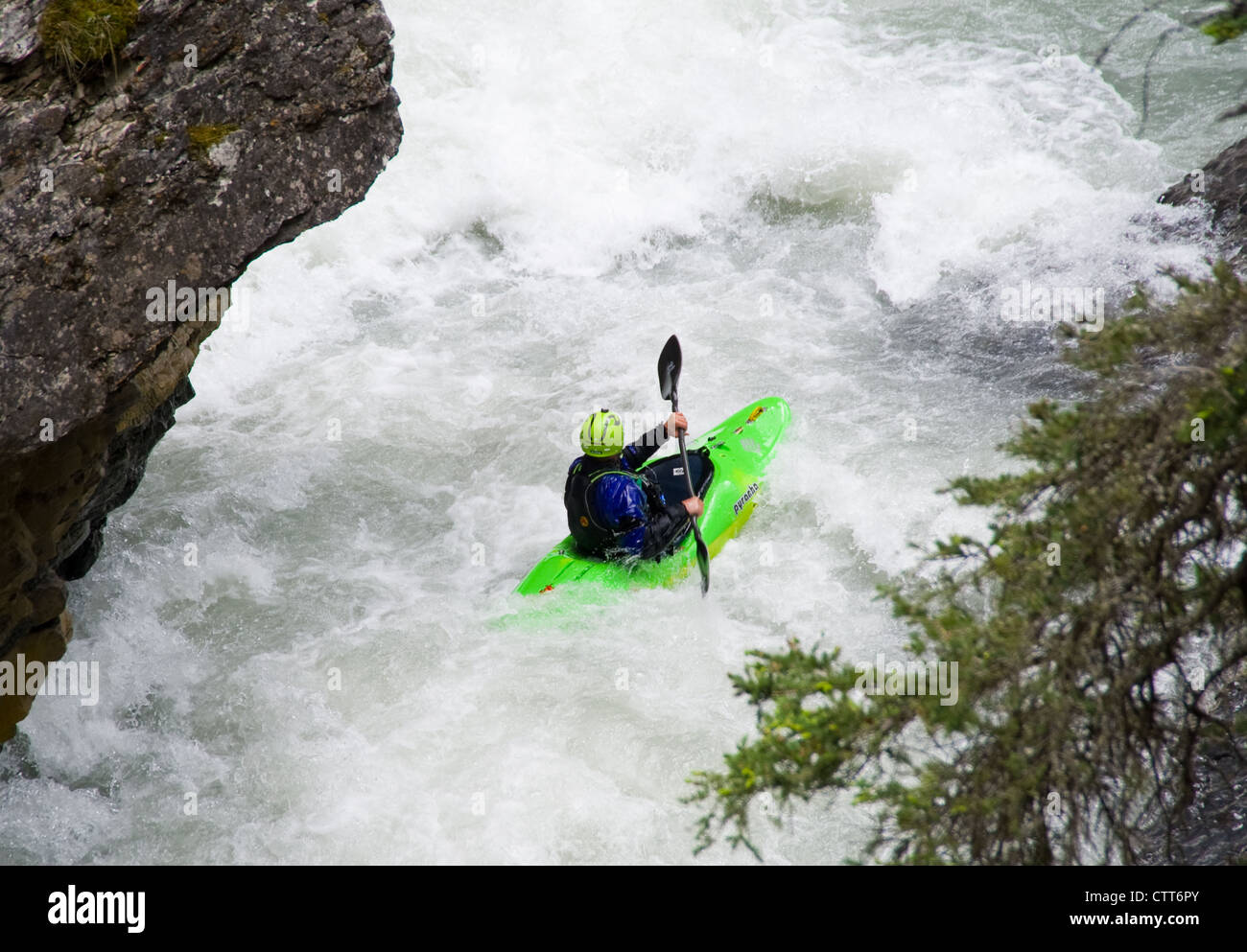 fast river water stream canoe riding paddle control Stock Photo - Alamy