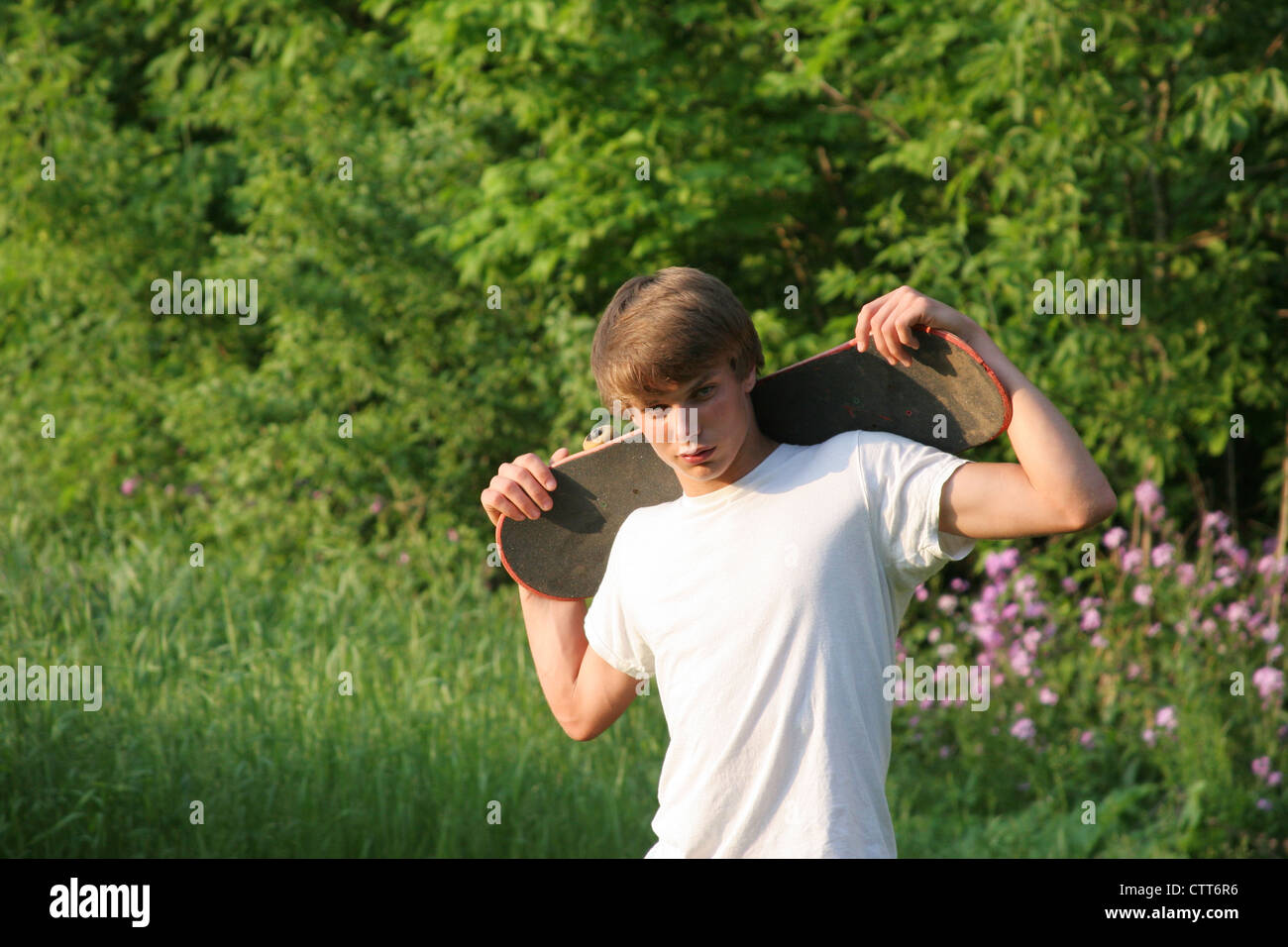 A young boy with a skate board Stock Photo - Alamy