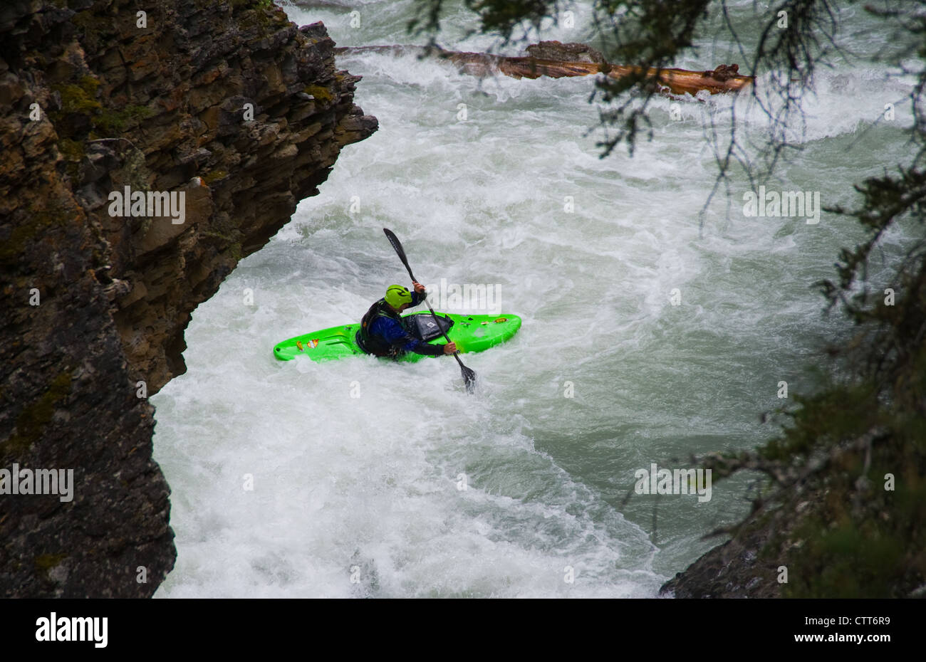 fast river water stream canoe riding paddle control Stock Photo - Alamy