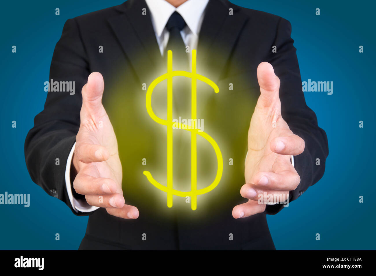 Businessman holding graphic dollar sign Stock Photo - Alamy