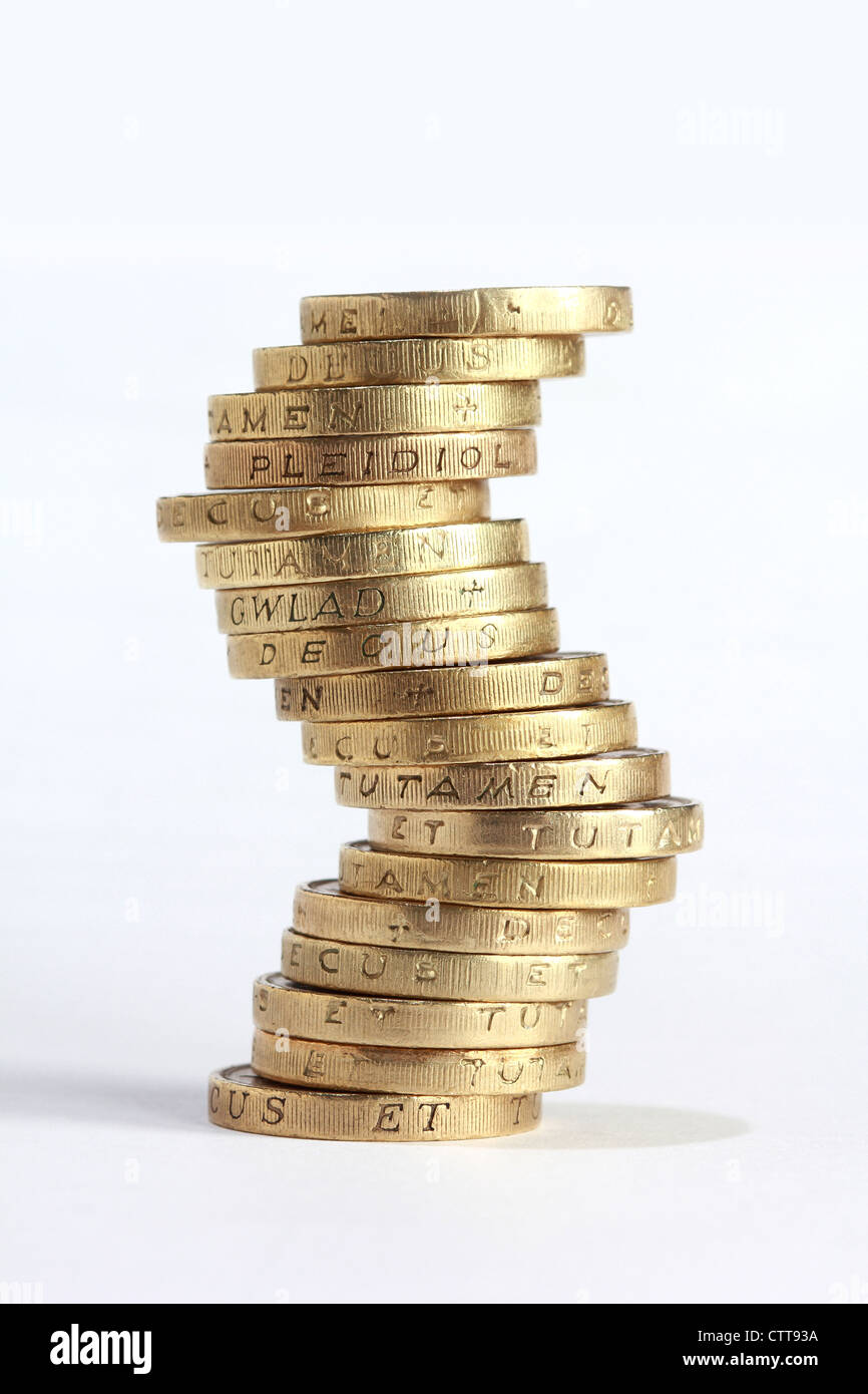 unstable coin stack, british currency Stock Photo - Alamy