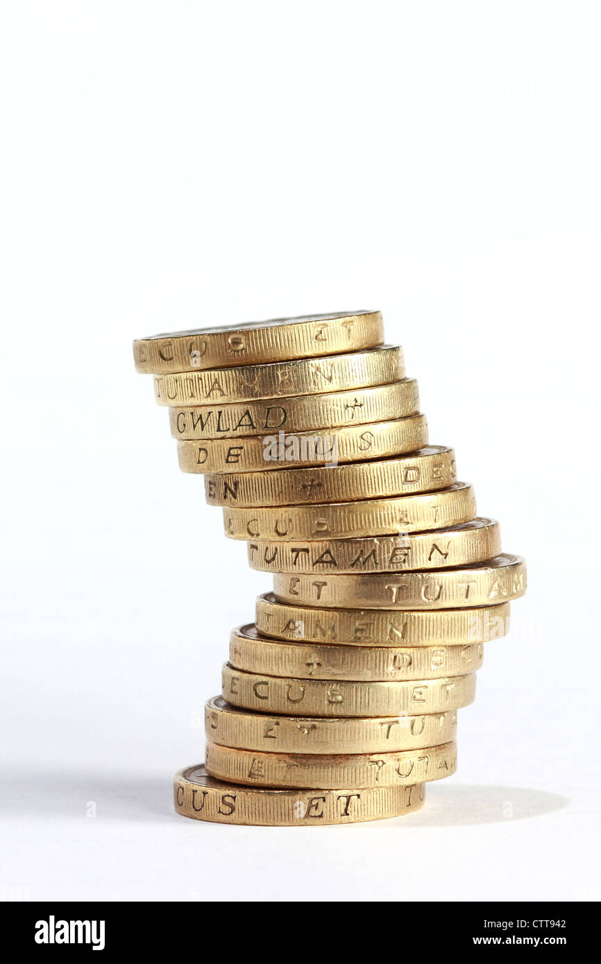 unstable coin stack, british currency Stock Photo - Alamy