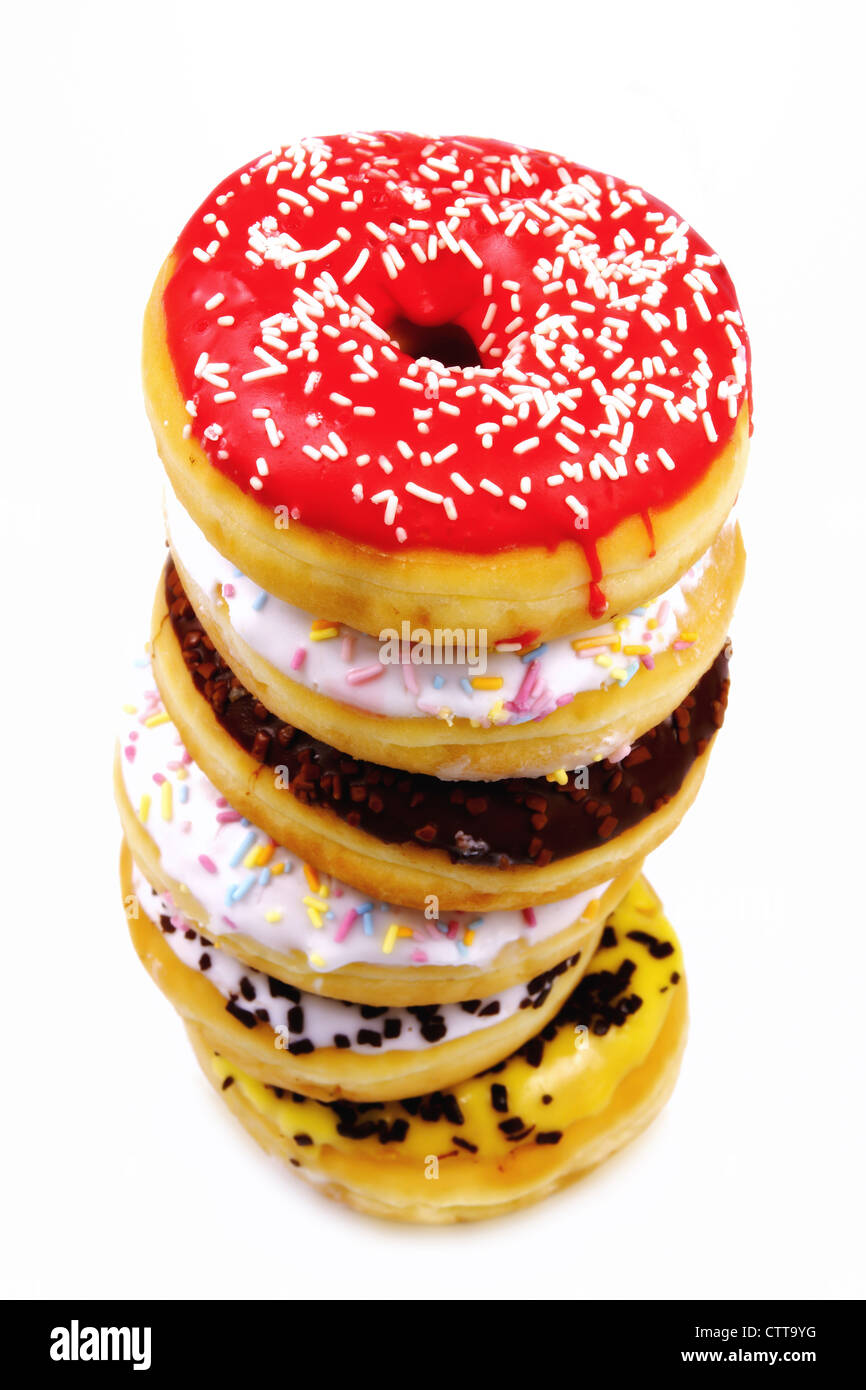 stack of colorful and delicious donuts on a white background Stock ...