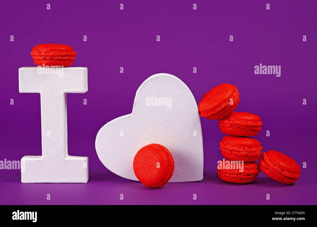 strawberry macaroons on a purple background with the letter 'I' and a ...