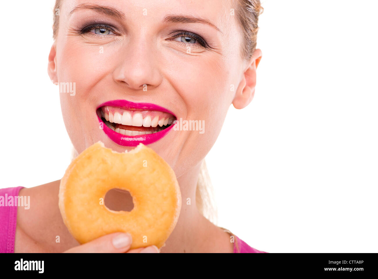woman biting into a ring donut Stock Photo - Alamy