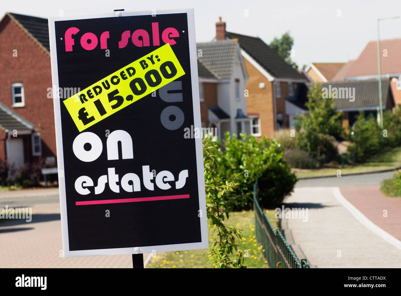 Reduced price property sale sign Stock Photo - Alamy